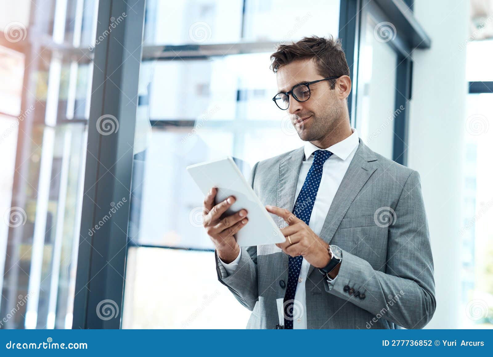 Staying Current on Tech Trends. a Professional Businessman Using a ...