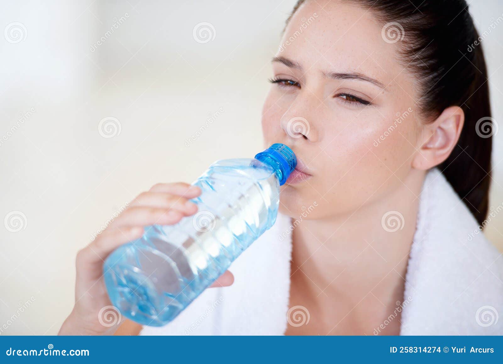 Staying Hydrated After A Workout Young Woman Drinking Water After A