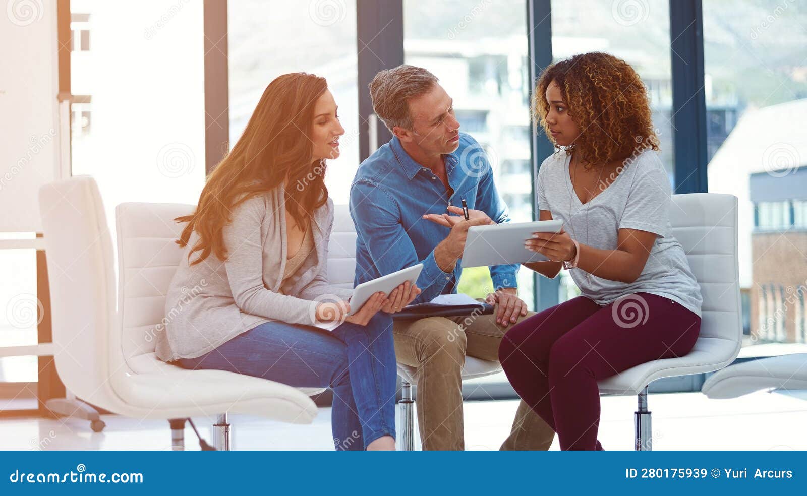 Staying Informed As a Team. a Creative Team Using a Digital Tablet ...