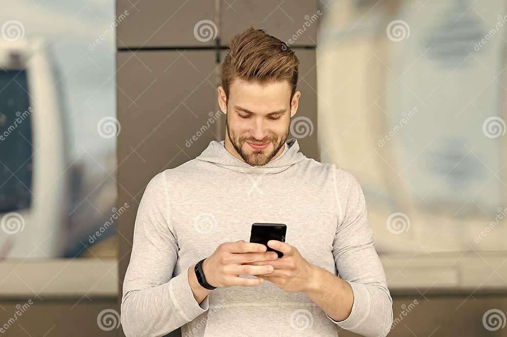 Staying In Touch Man With Beard Walks With Smartphone Urban