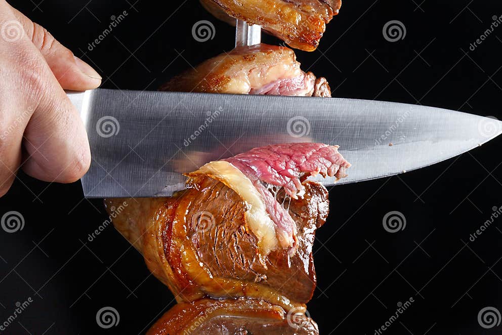 Steak being sliced stock photo. Image of dinner, cooking - 60173546