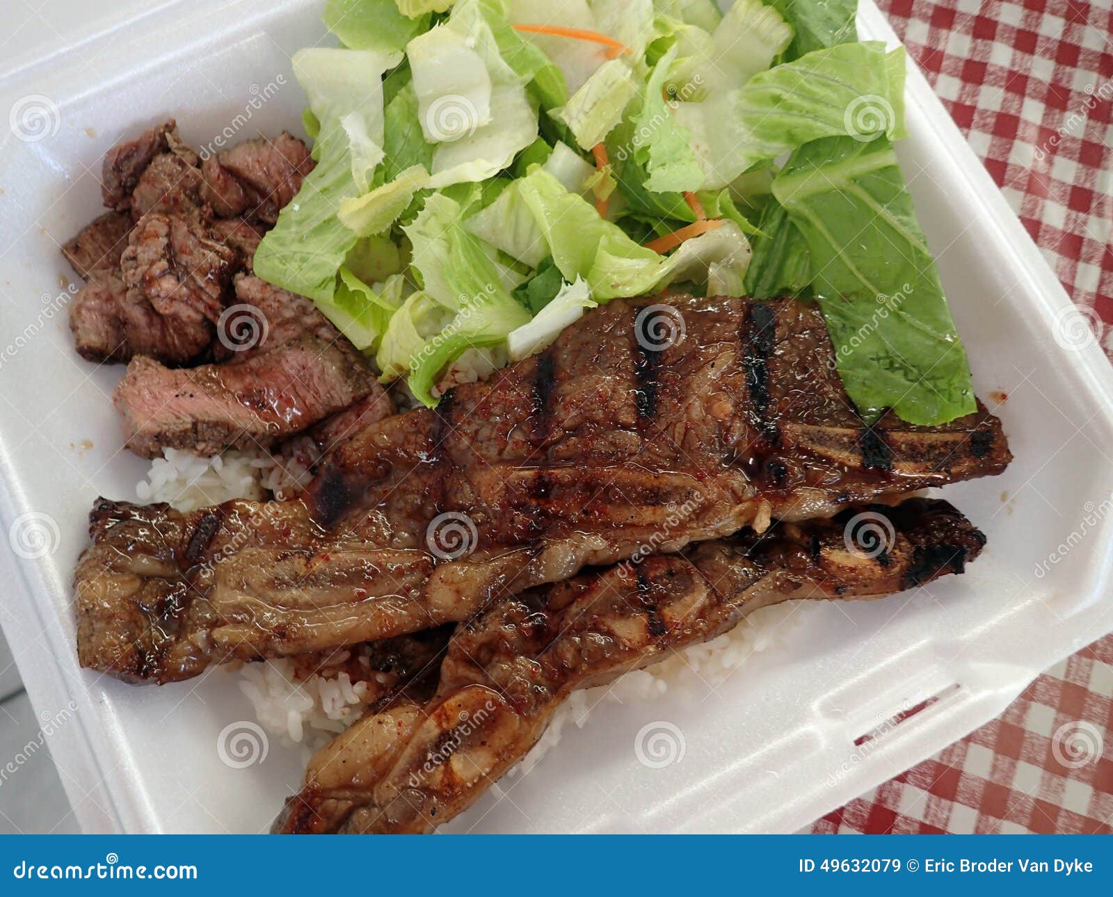 Steak, Kalbi, Side Salad And White Rice In A Styrofoam Plate Stock ...