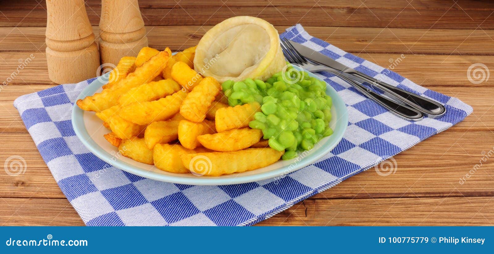 Steak and Kidney Pudding Meal with Chips and Mushy Peas Stock Image ...