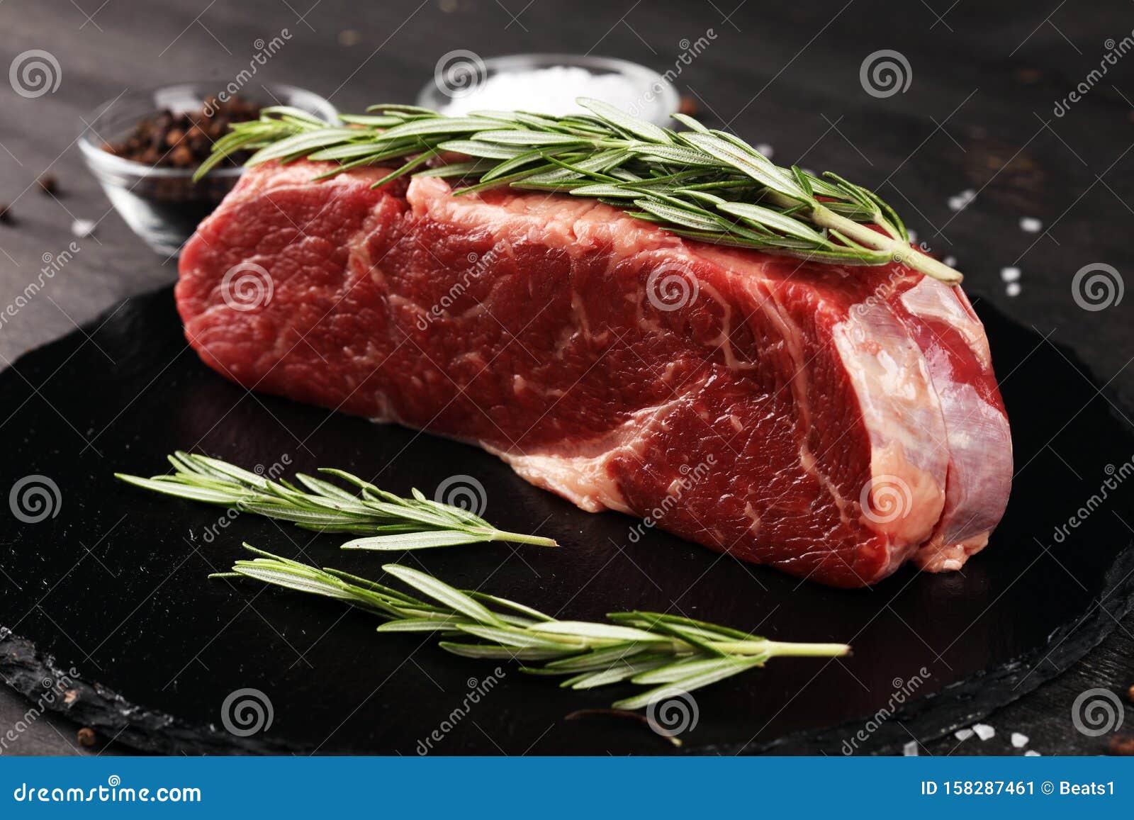 Steak Raw. Barbecue Rib Eye Steak or Rump Steak on Dark Rustic Table ...