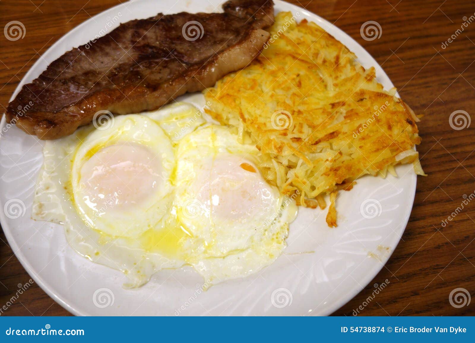 Steak Ribs with Two Eggs Over Easy and Hash-brown Potatoes Stock Photo ...