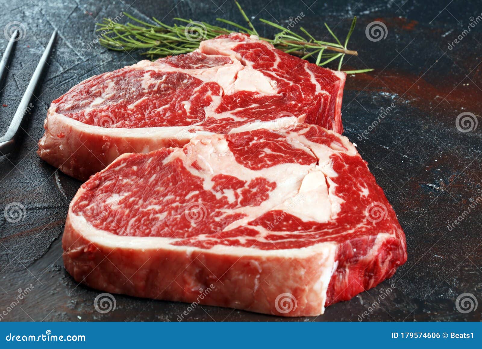 Steak. Two Fresh Raw Rib-eye Steak with Rosmary in a Rustic Style Table ...