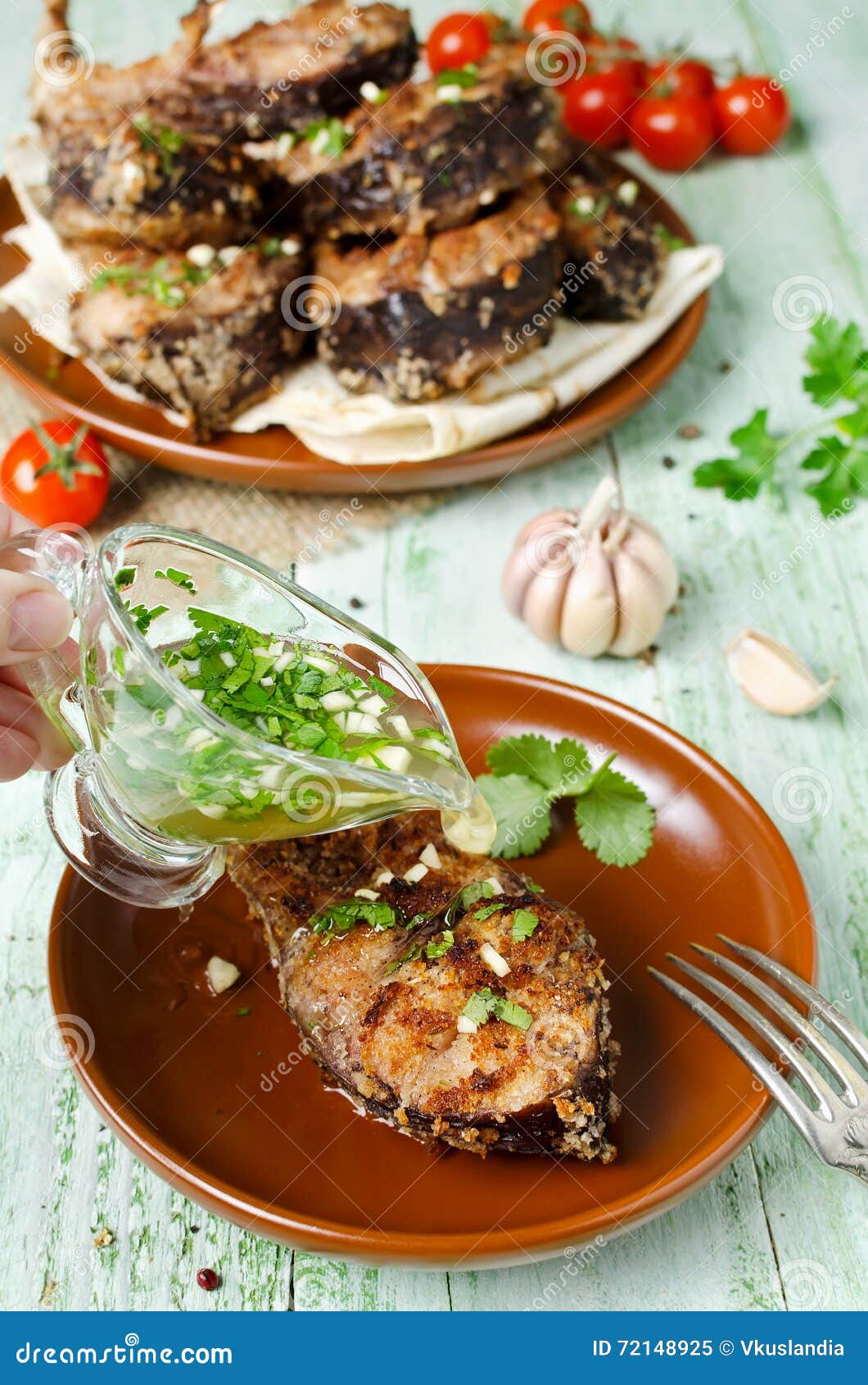 Steaks of Carp in Bread Crumbs and Spices with Fish Broth Stock Image ...