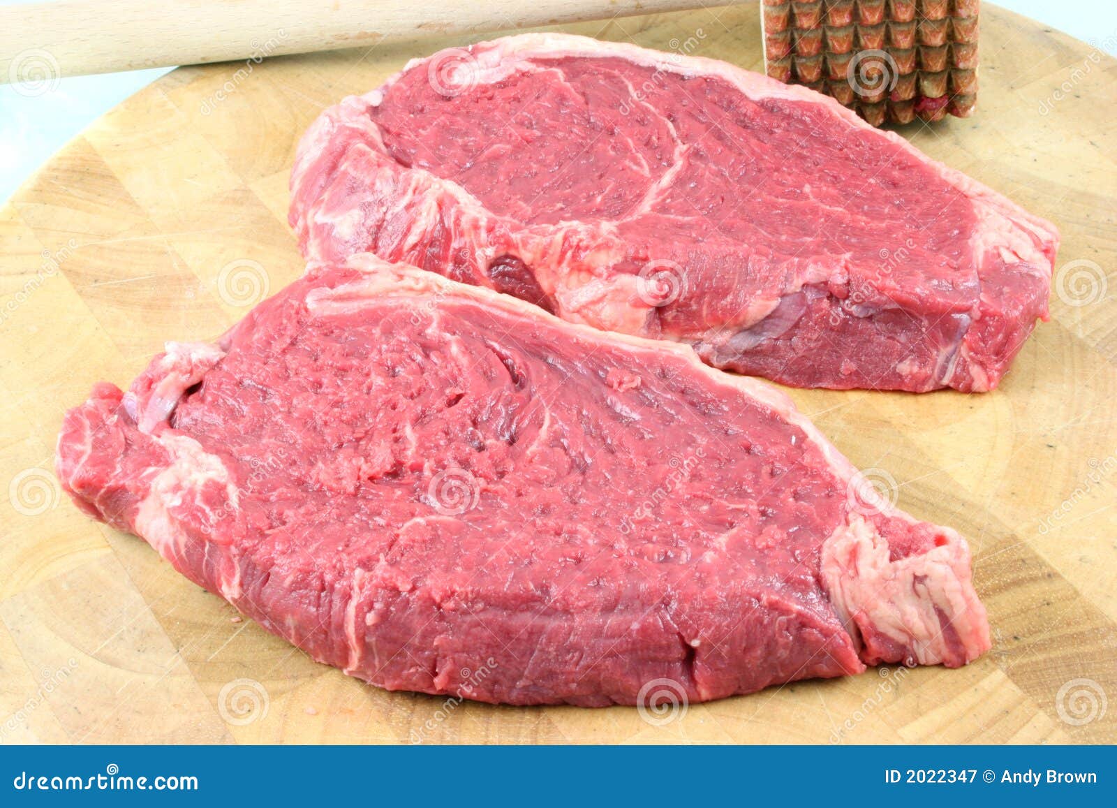 Steaks on a chopping board stock image. Image of butcher - 2022347