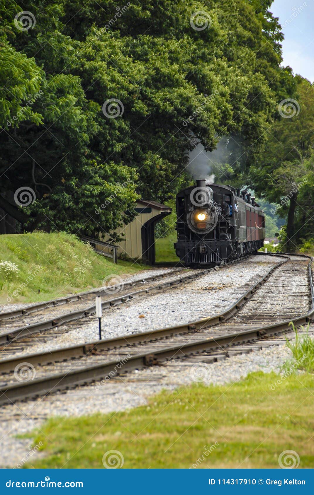 Steam Engine with Passenger Train Pulling into Station Pt 1 Stock Photo ...