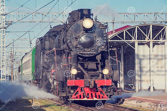 Steam Train Approaches To the Platform Stock Photo - Image of railroad ...