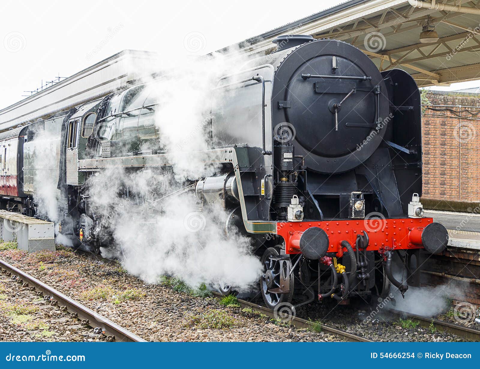 Steam Train at Station stock photo. Image of front, steel - 54666254