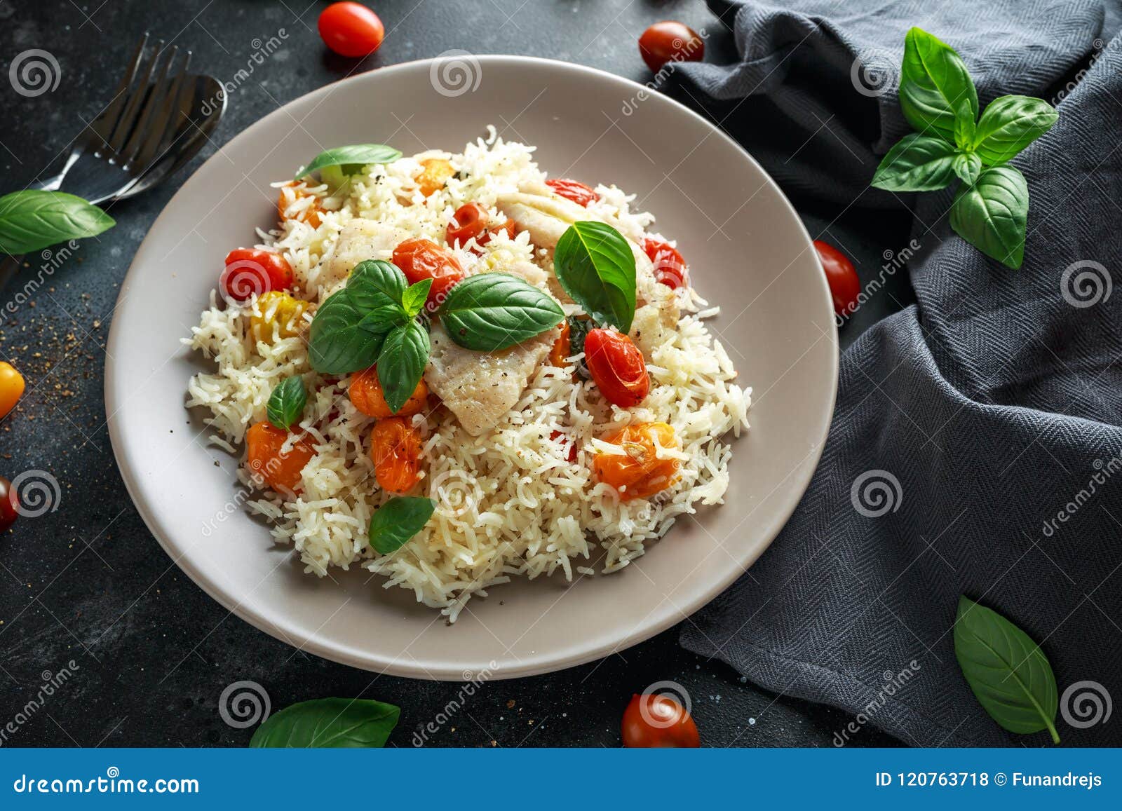 Steamed Cod Fish with Rice and Cherry Mix Tomatoes and Basil Herbs in a ...