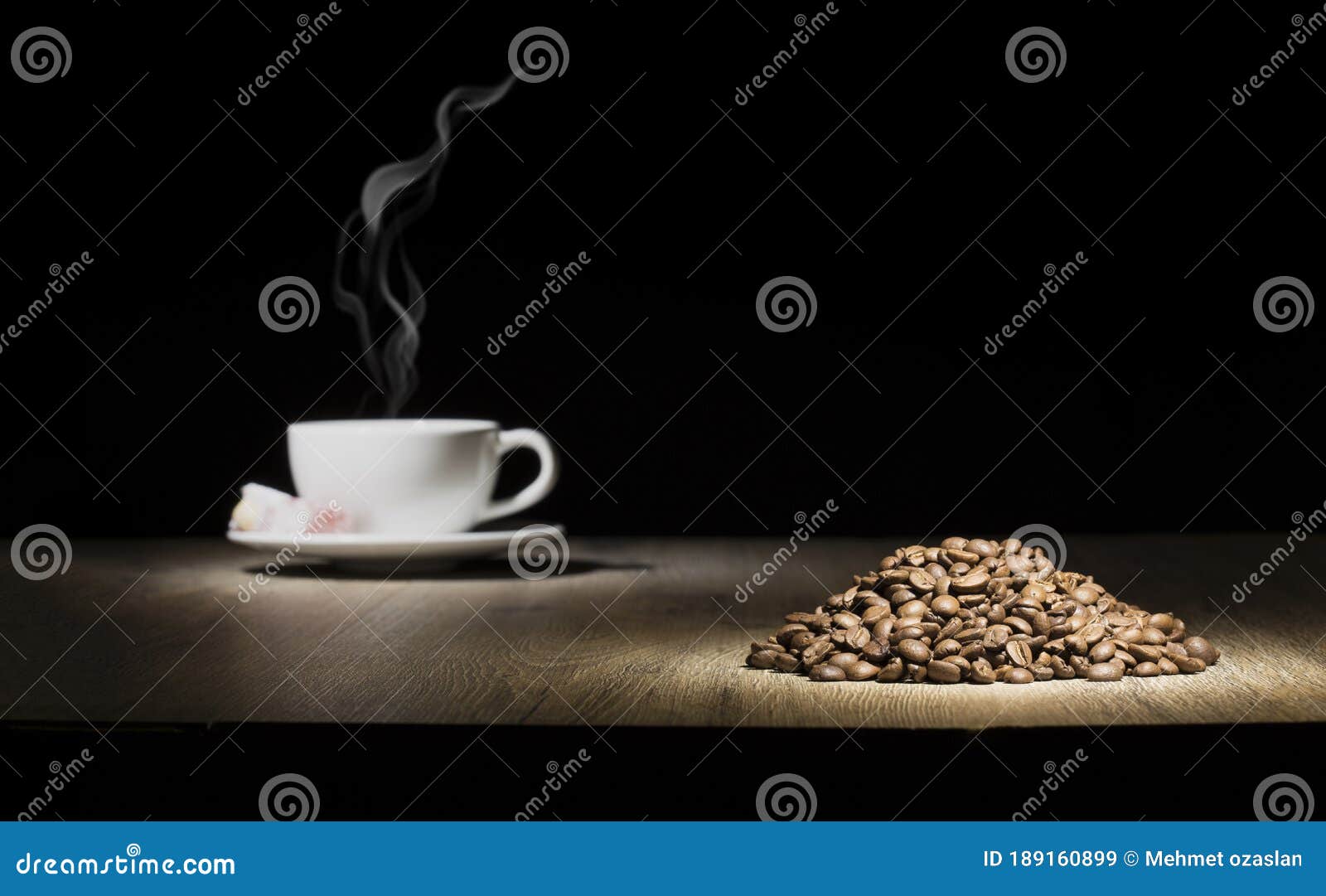 Steamed Coffee Cup on the Wood Table with Coffee Beans Stack Stock ...