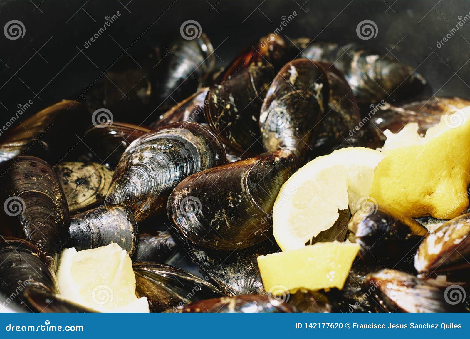 Steamed Mussels in a Classic Pot with Some Pieces of Lemon Stock Photo ...