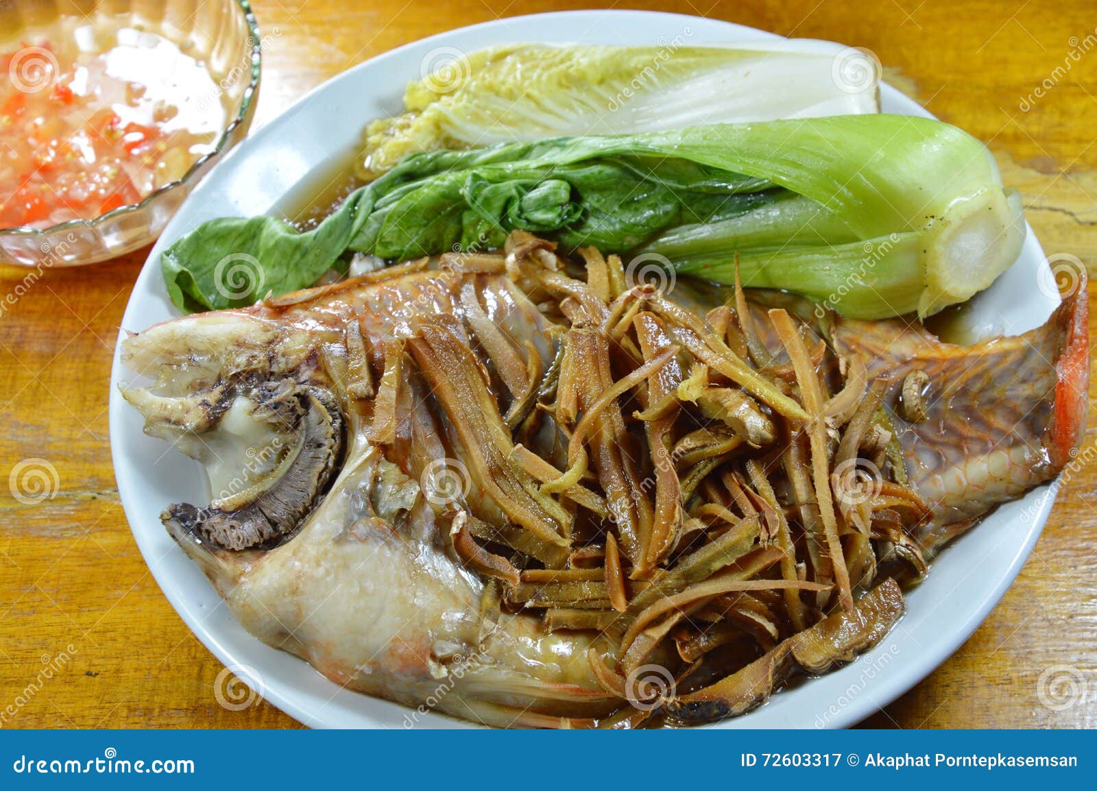 Steamed Red Mango Fish in Soy Sauce Topping Slice Ginger on Dish Stock ...