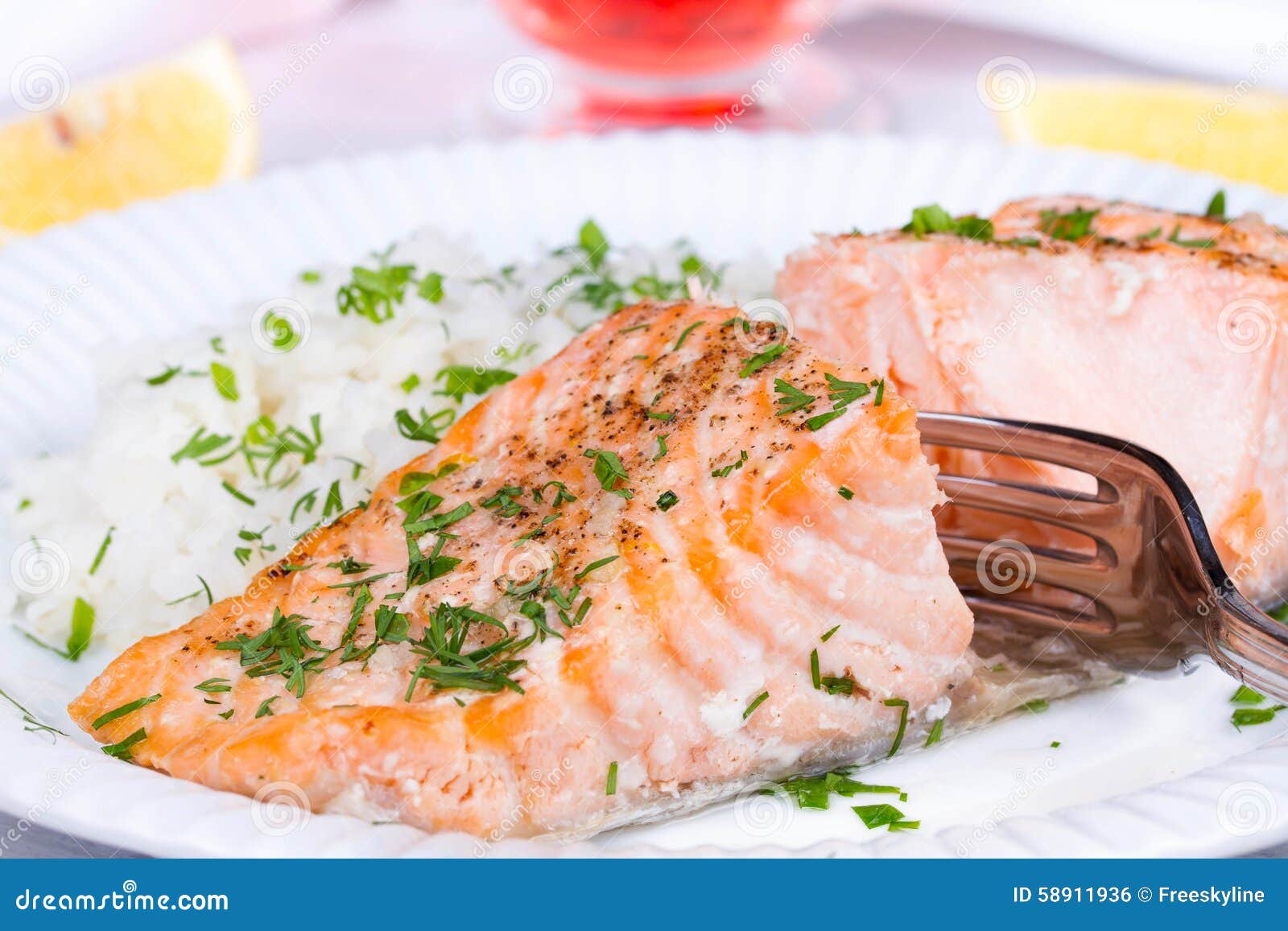 Steamed Salmon with Fresh Herbs and Lemon. Rice As a Garnish. Stock ...