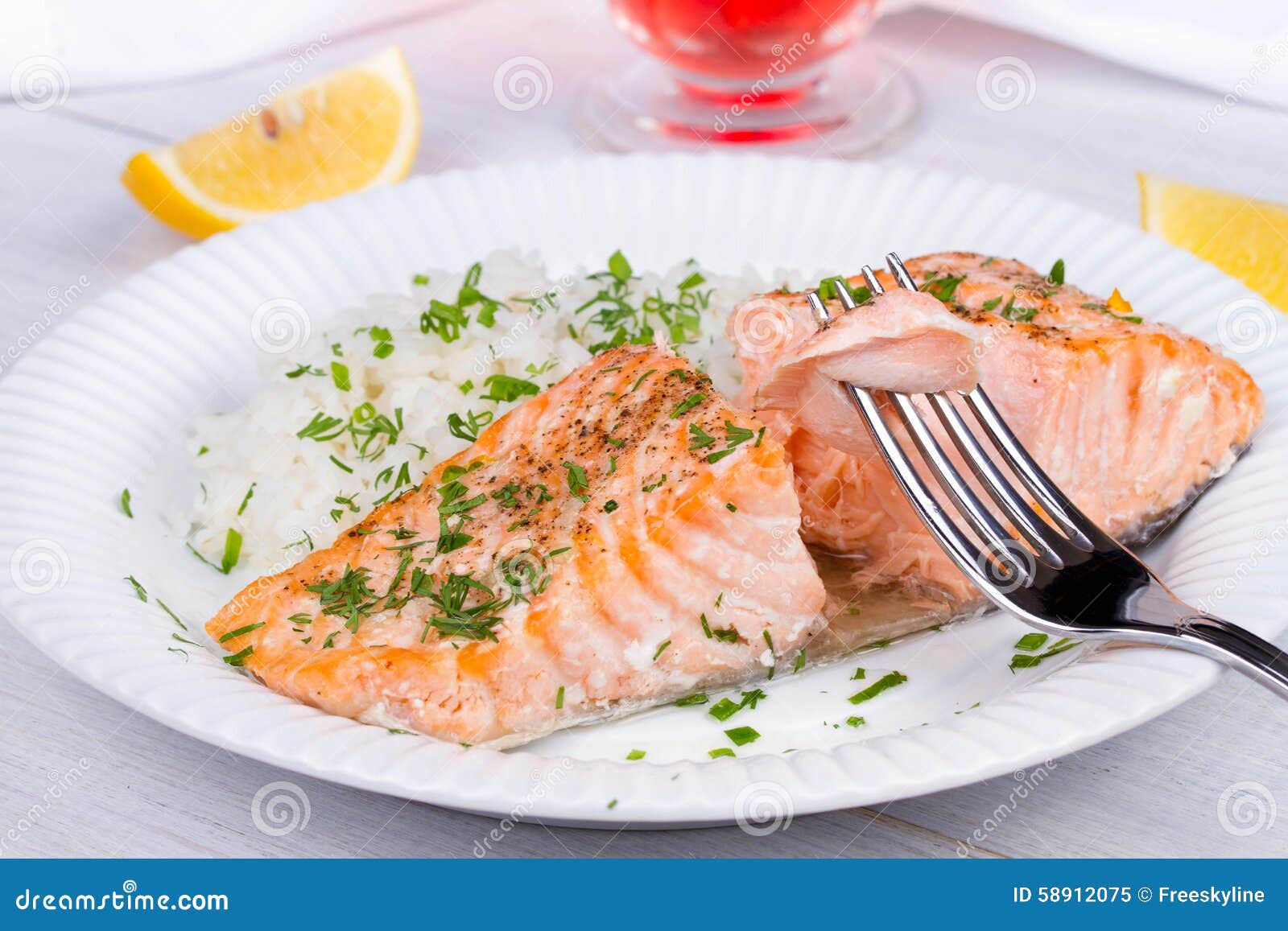 Steamed Salmon with Fresh Herbs and Lemon. Rice As a Garnish. Stock ...