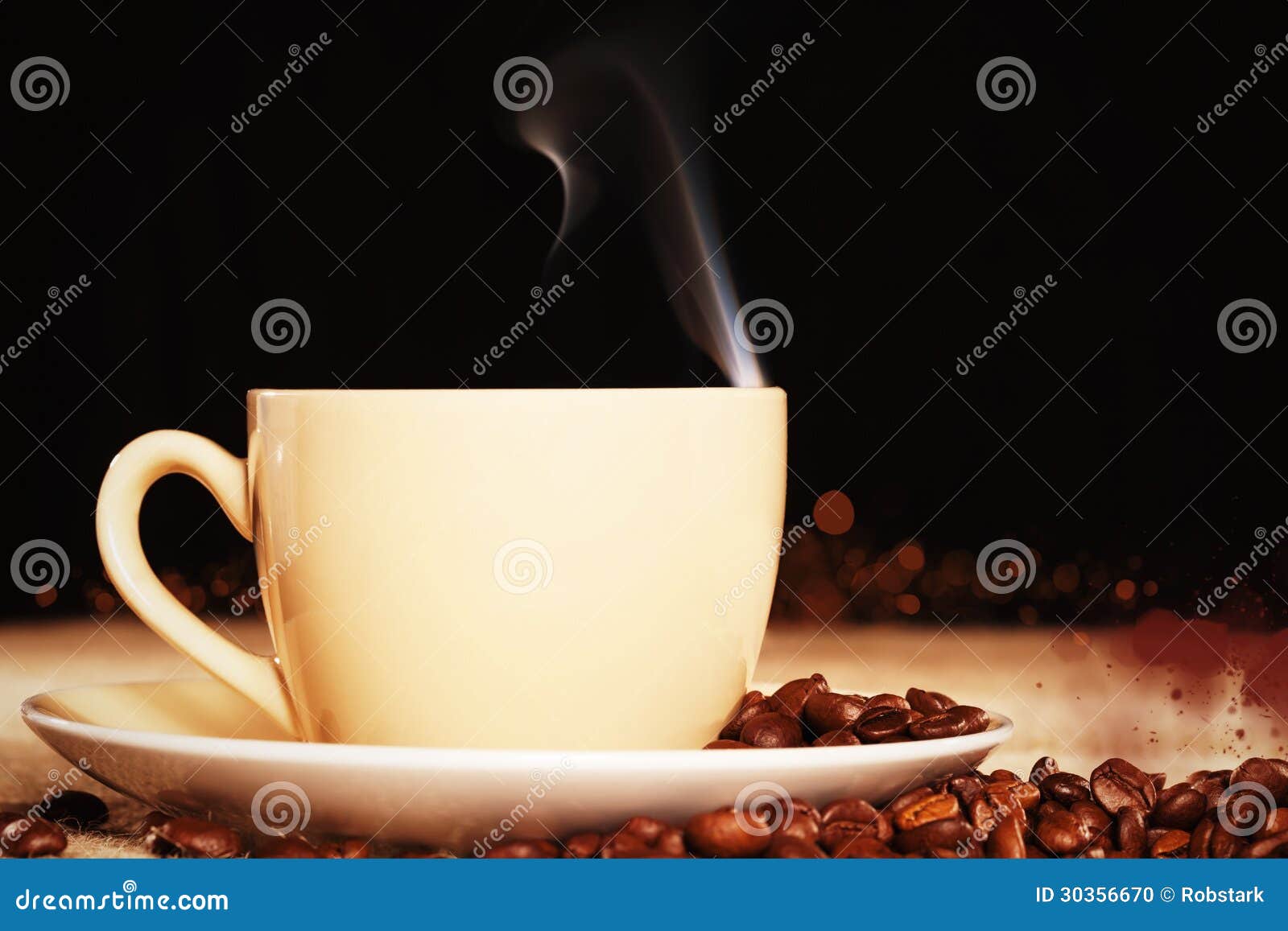Steaming Coffee Cup with Coffee Beans on a Jute Fabric Stock Photo ...