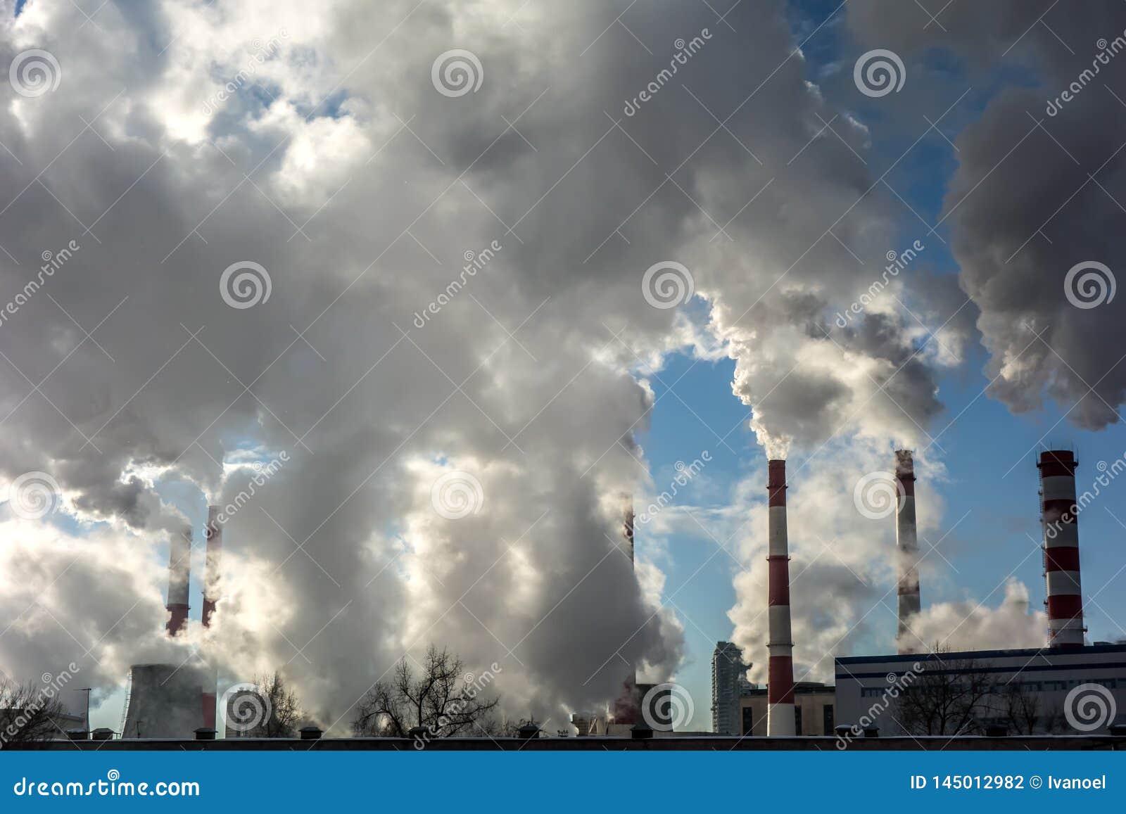 Steaming Smoke Stack and Cooling Tower with Pollution Stock Photo ...