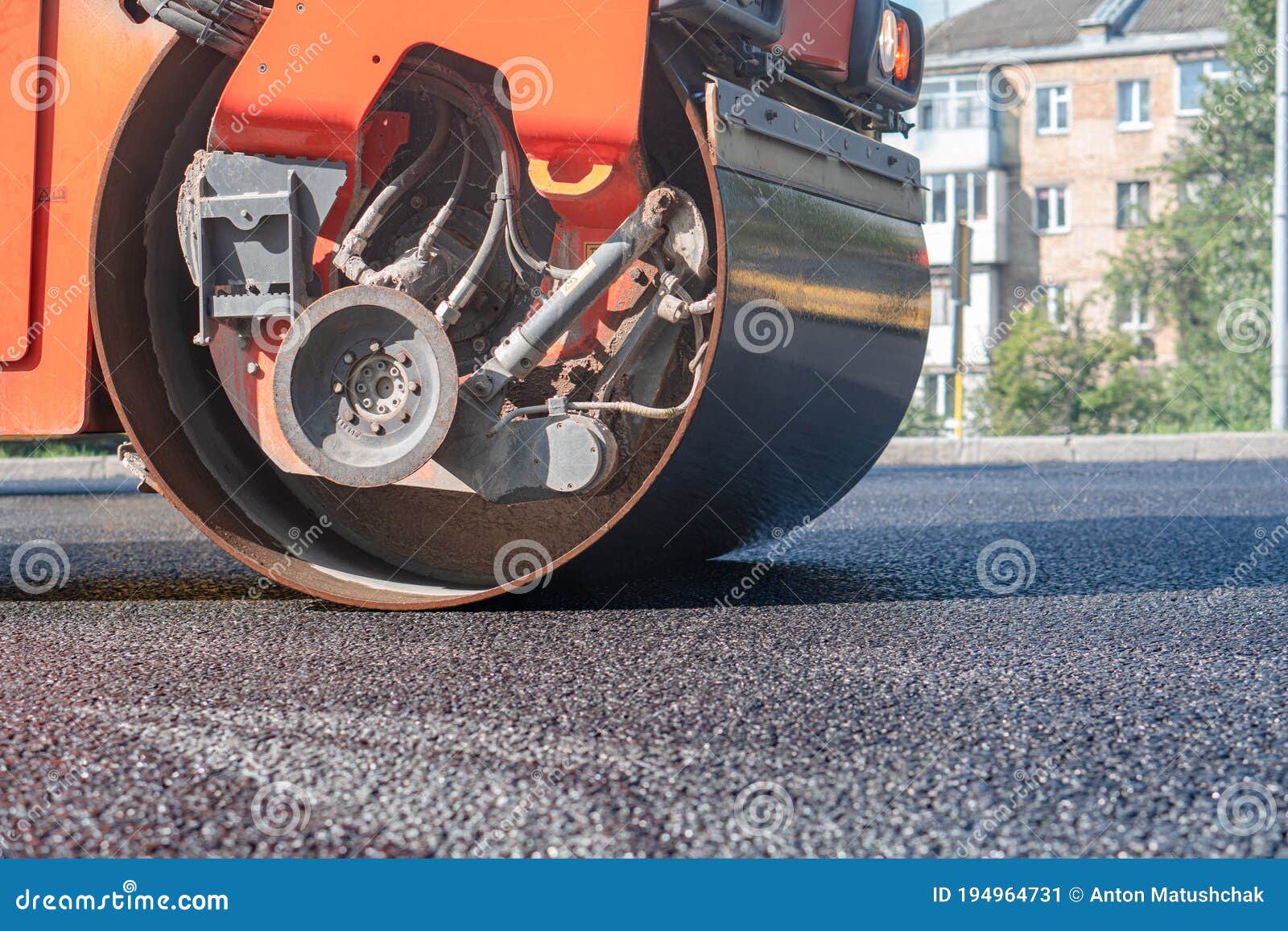 The Roller Flattens the Asphalt Tar, Paving the New Asphalt Stock Image ...