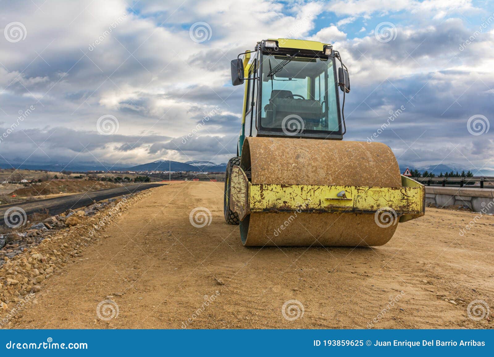 Steamroller Performing Leveling Work on a Road Under Construction Stock ...