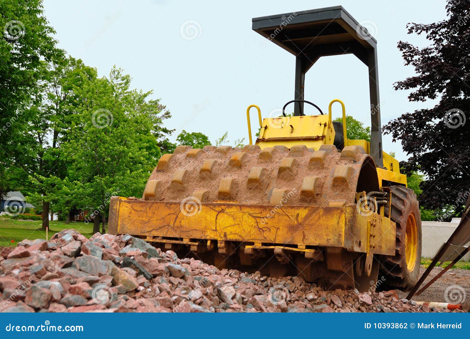 Steamroller And Road Construction Workers At Road Construction Site ...
