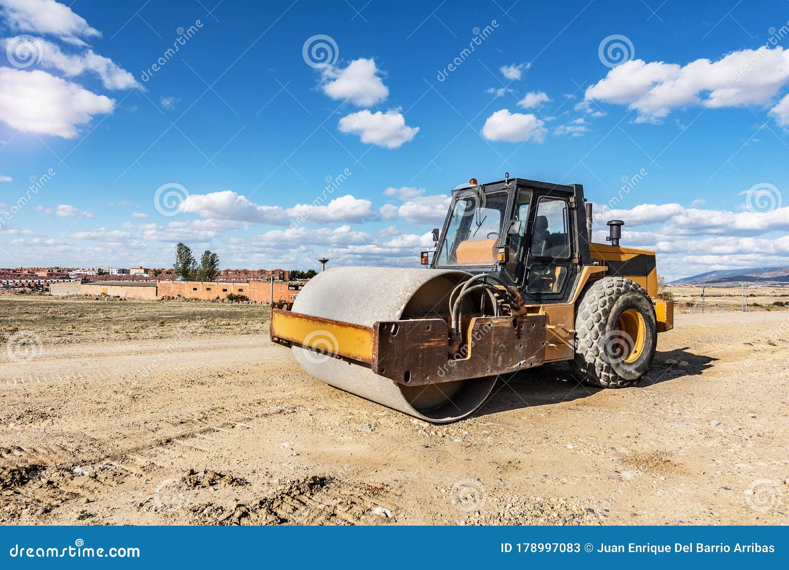 Steamroller And Road Construction Workers At Road Construction Site ...