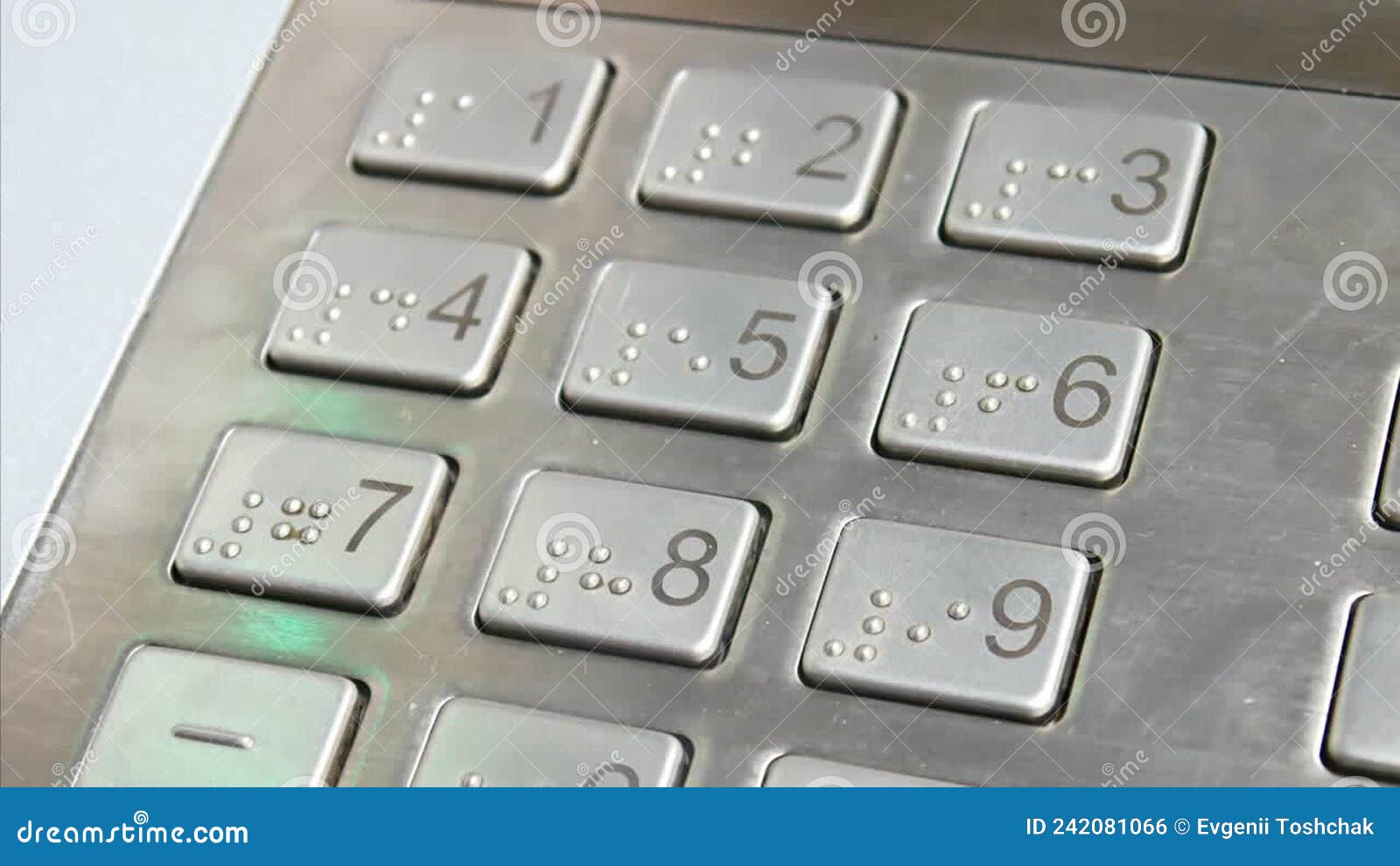 Close-up of a Steel ATM Keyboard Panel and a Hand Typing Pin Code on it ...