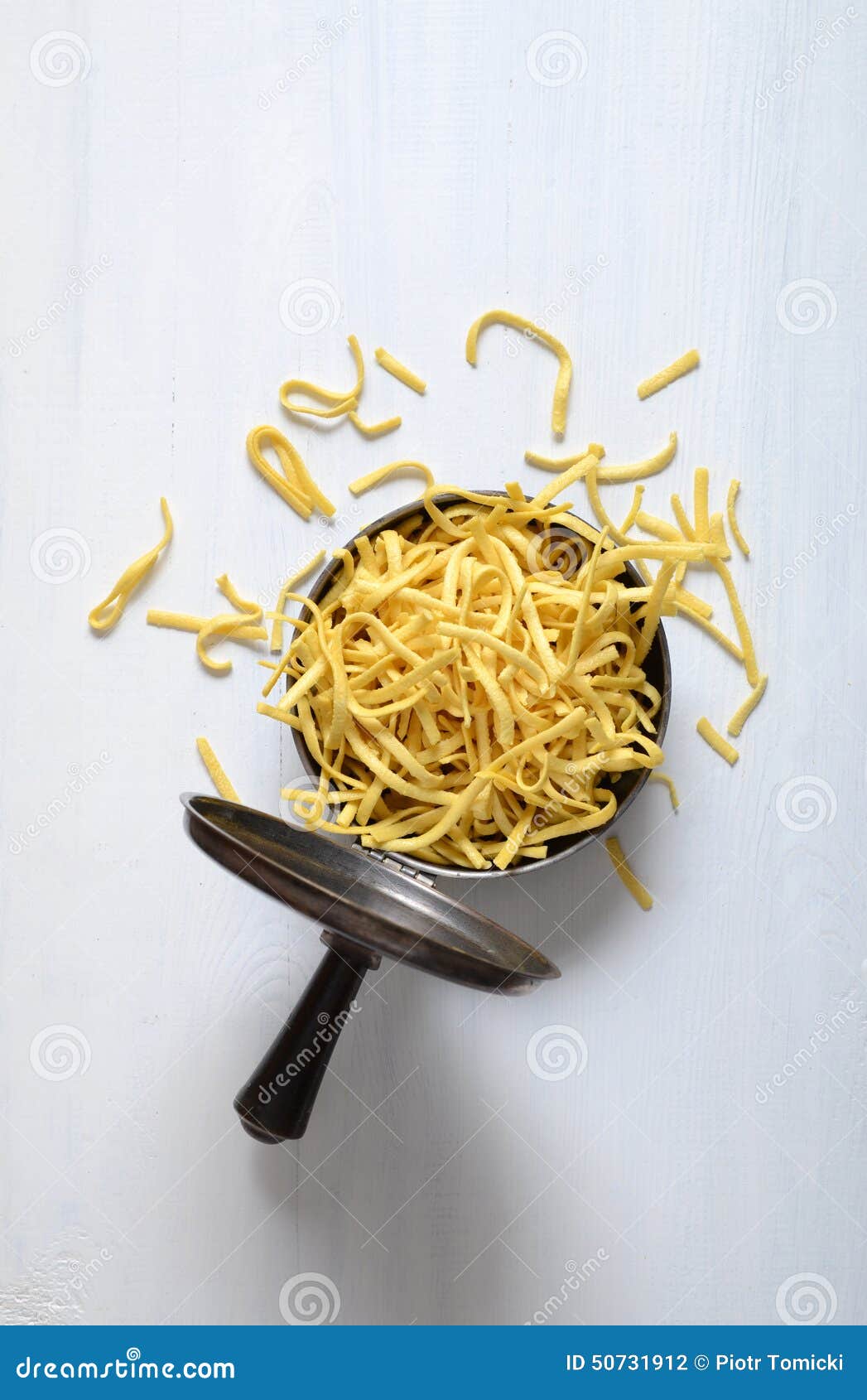 Steel bowl full of pasta stock photo. Image of board - 50731912