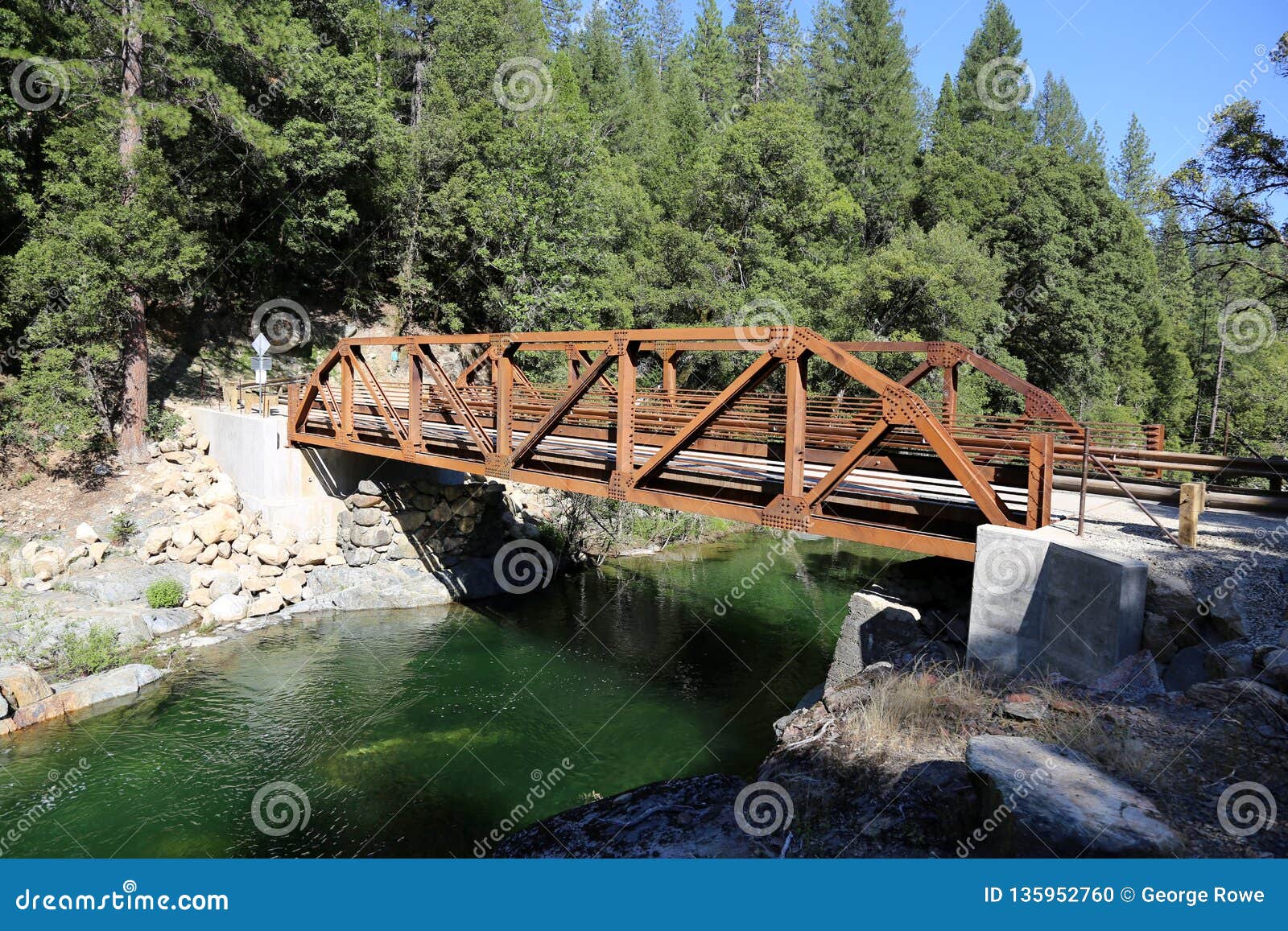 Steel Bridge Over River with Pine Trees Stock Photo - Image of year ...