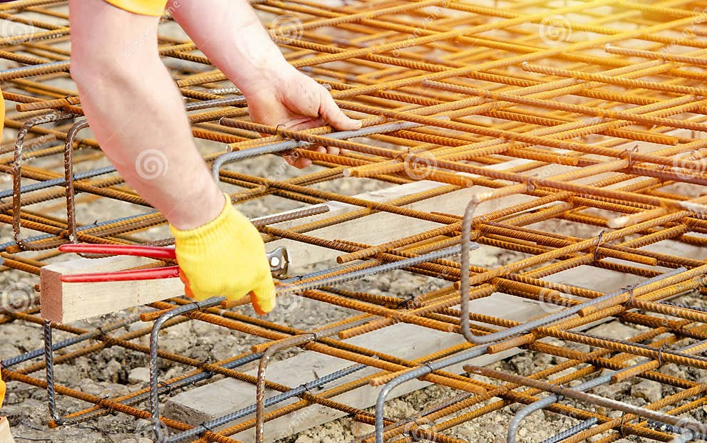 Steel Fixer Assembling Reinforcement Cage Off Rebars. Selective Focus ...