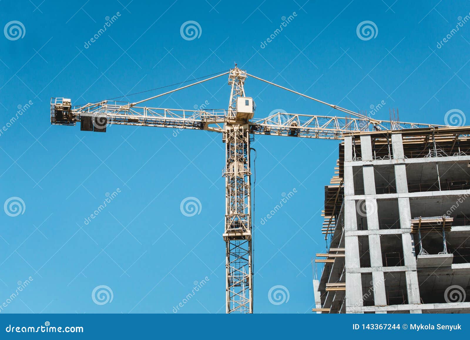 Steel Frames of a Building Under Construction, with Tower Crane Stock ...