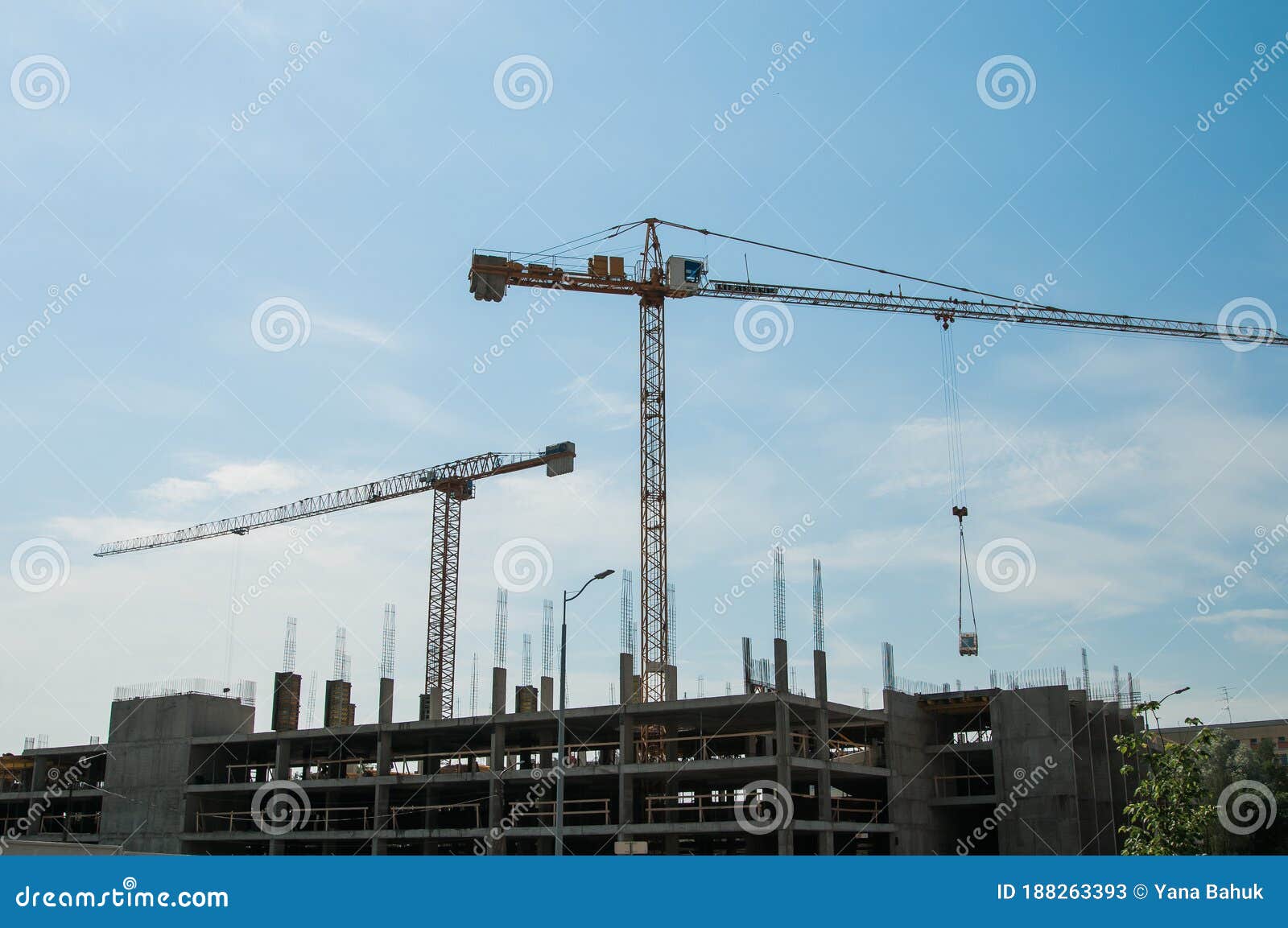 Steel Frames of a Building Under Construction, with Tower Crane on Top ...