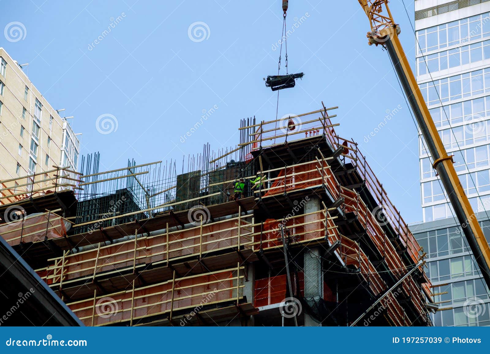 Steel Frames of a Building Under Construction with Tower Crane on Top ...