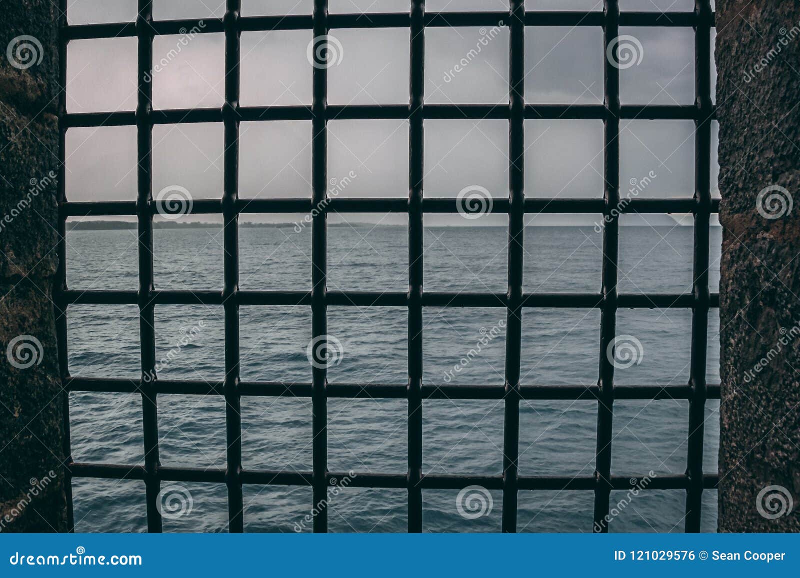Steel Mesh Grid Window in a Castle Looking Out at the Sea Stock Photo ...