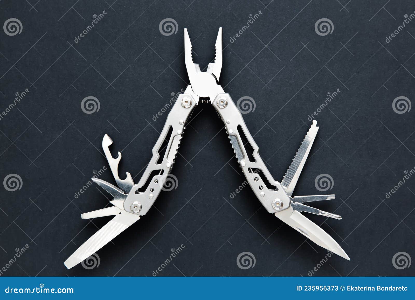 Steel Multitool Multi Function Tool on Dark Background, Close-up. Stock ...