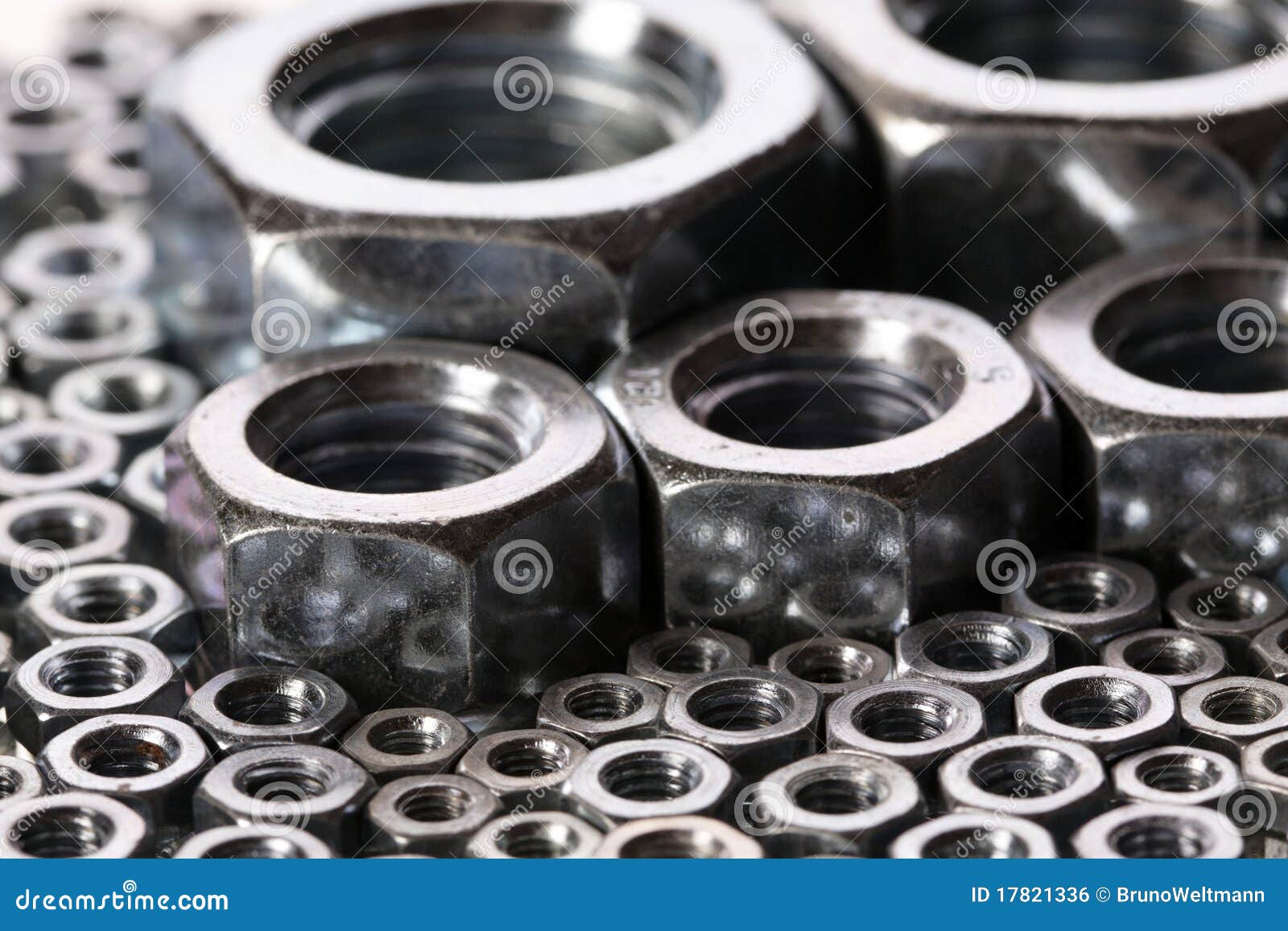 Steel Nuts and Screws on Mirror Stock Photo - Image of nuts, metallic ...