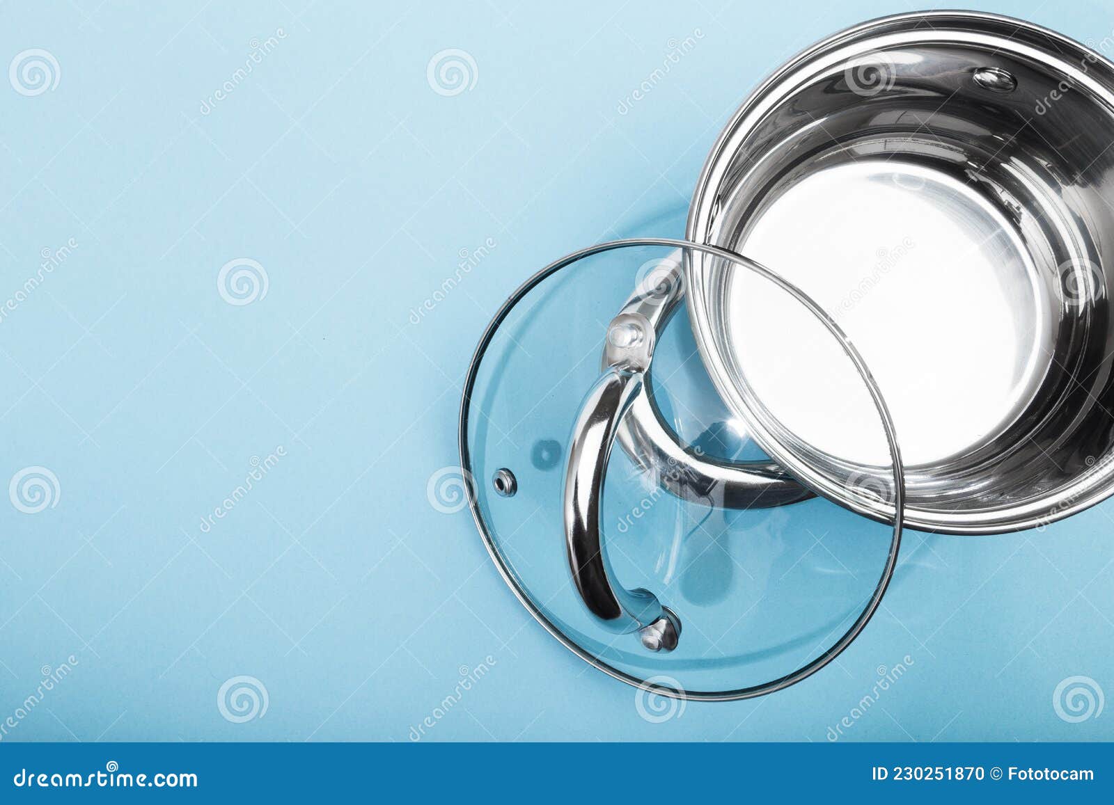 Steel Pan with a Transparent Lid on Blue Background Stock Photo - Image ...