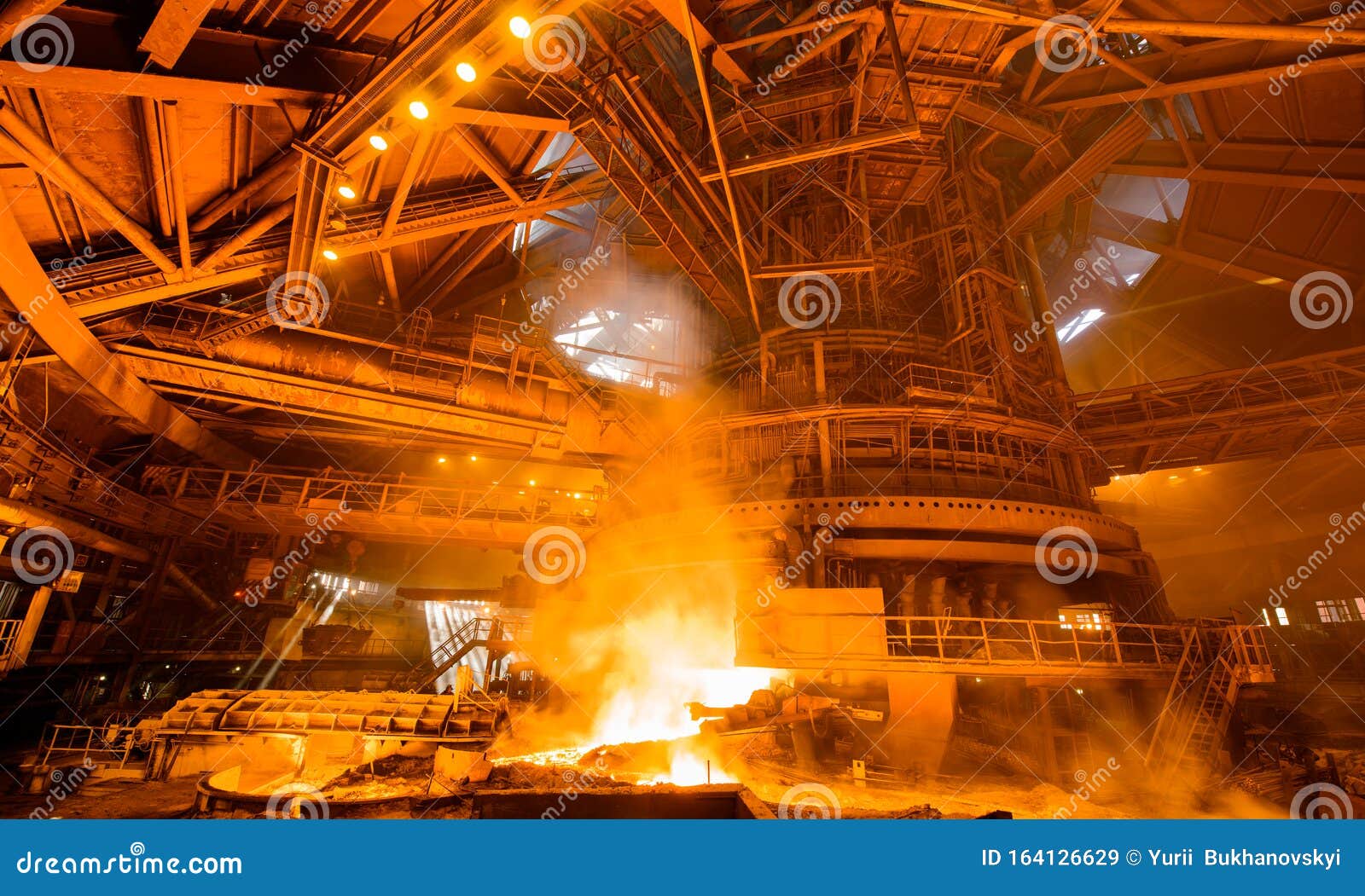 Steelworker Near a Blast Furnace with Sparks. Foundry. Heavy Industry ...