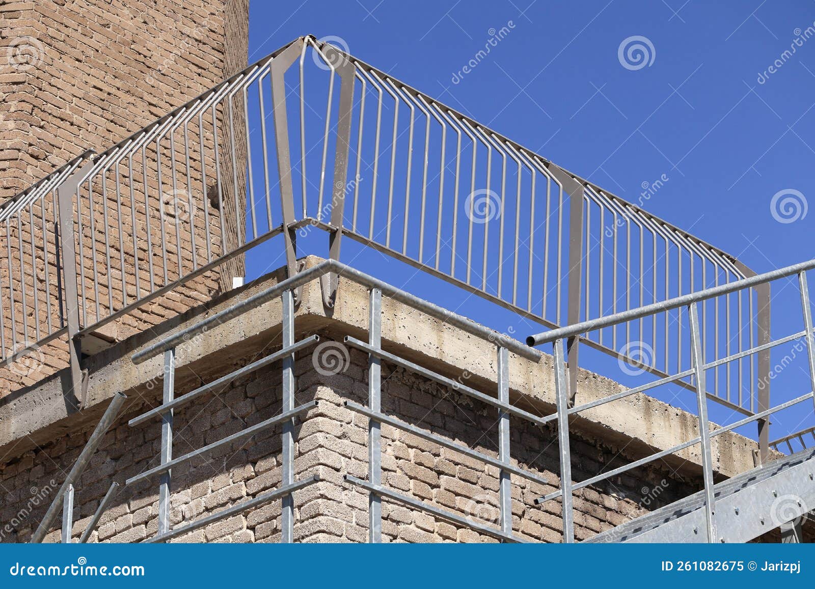 A Steel Railing Installed on the Terrace of a Gray Brick Building Stock ...