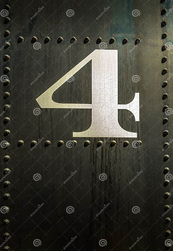 4 on Steel with Rivets stock image. Image of sign, darkness - 328909507