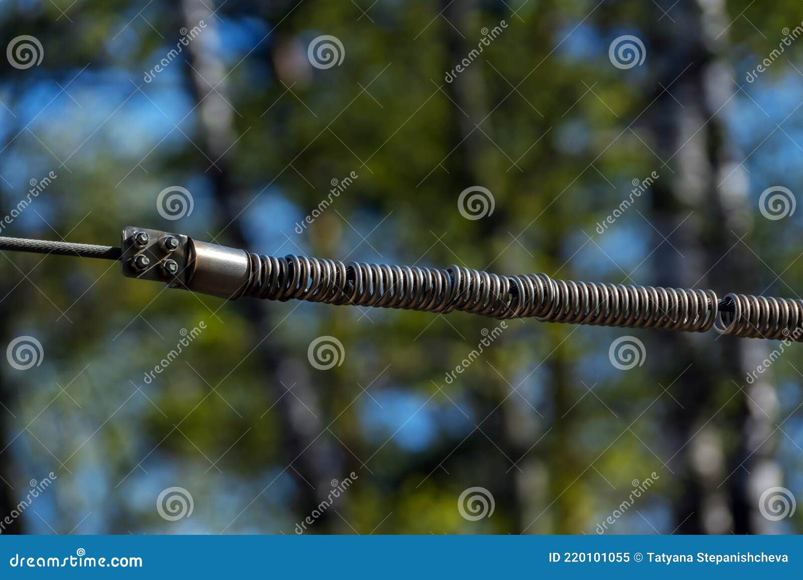 A Steel Spring is Attached To a Metal Cable. Horizontally Stock Image ...
