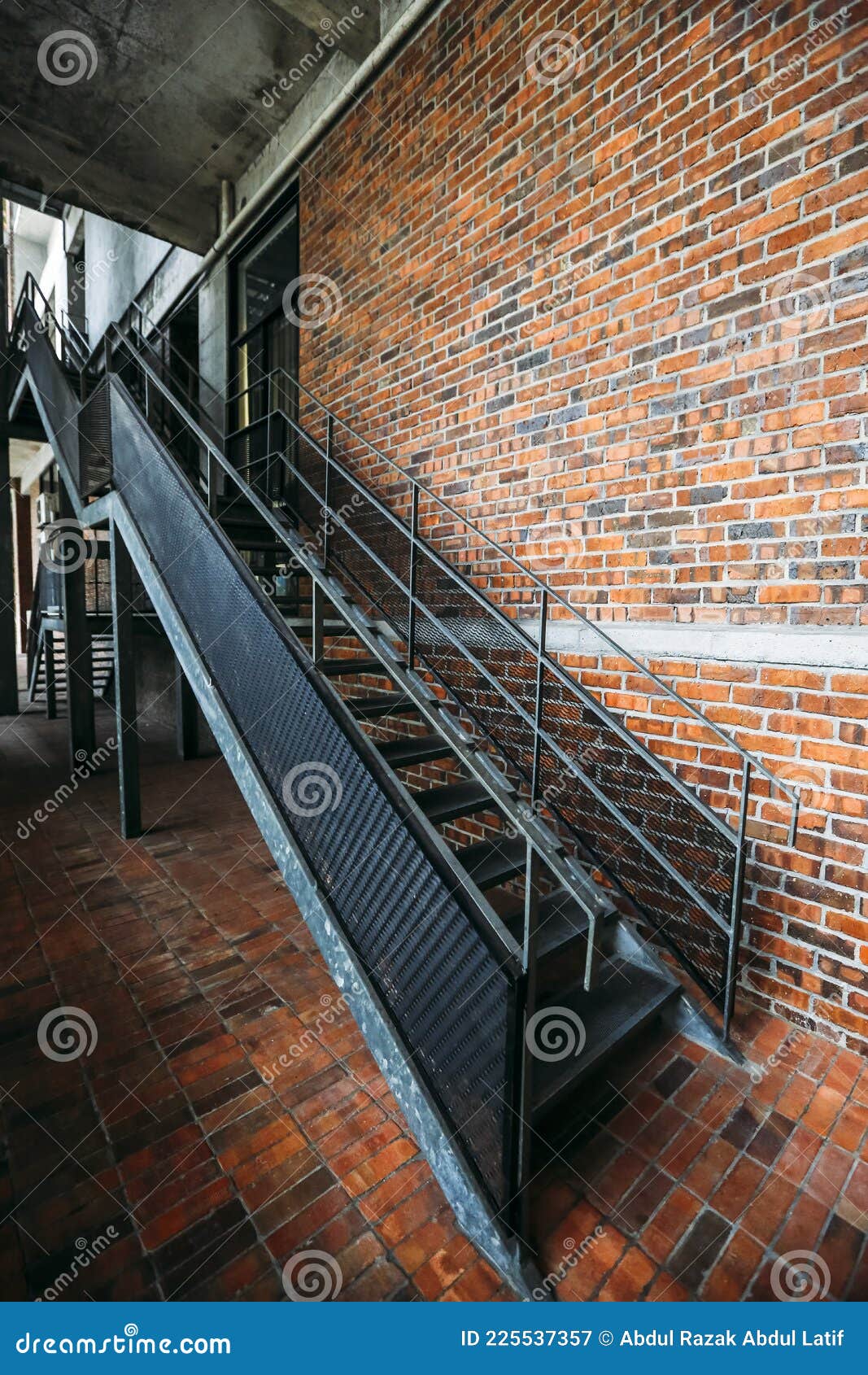 Steel Stairs with a Background of Old Red Brick Wall Texture Stock ...