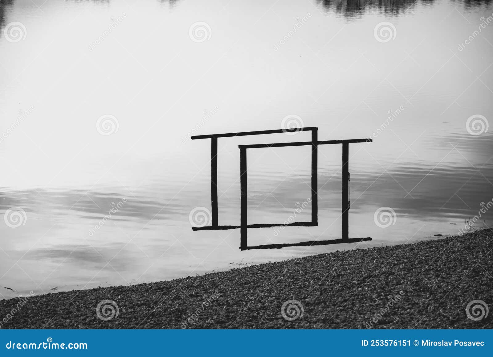 Steel Structures Standing in the Shallow Water, Reflected in the ...