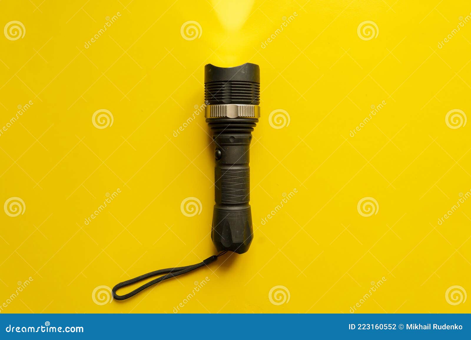 Steel Torch Isolated on Yellow Surface, Producing Light Beams or Rays ...