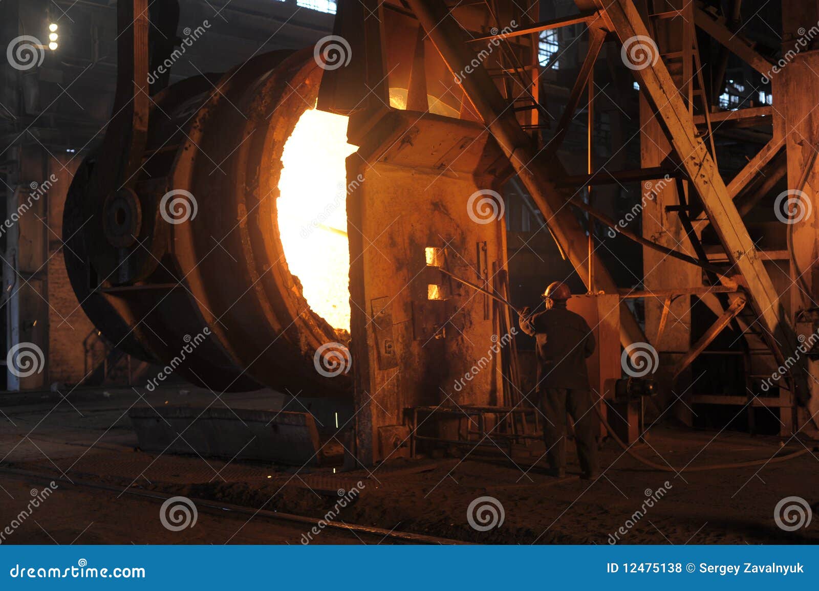 Steel Worker Removing Slag From The Electric Induction Crucible Melting ...