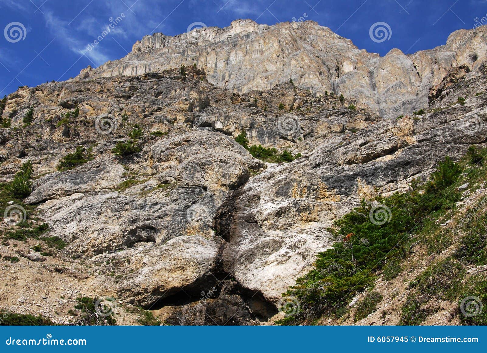 Steep rocky cliff stock image. Image of blue, clouds, canadian - 6057945