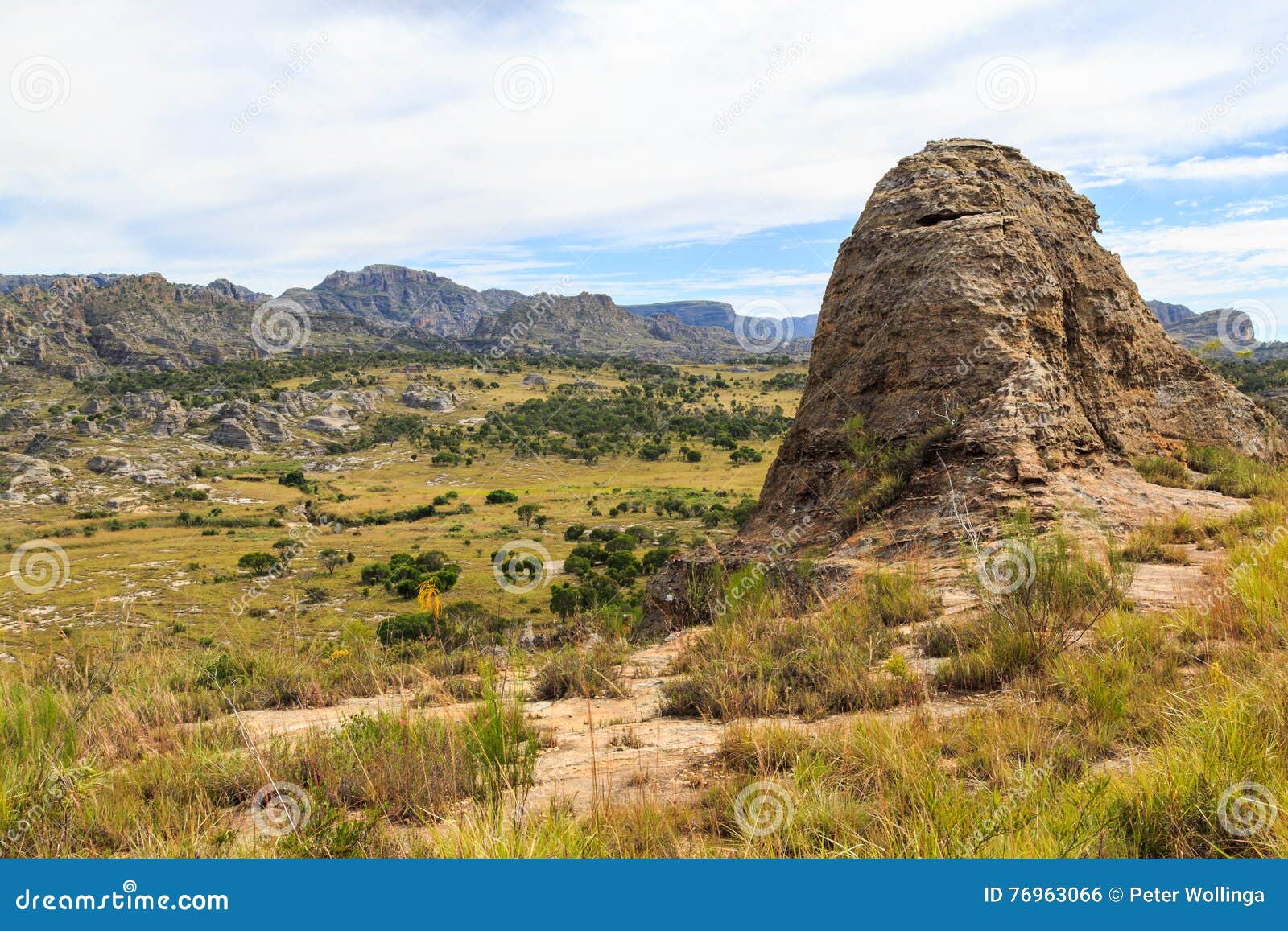 Steep Sharp Rocks Surrounding a Valley with Trees and Grassland Stock ...