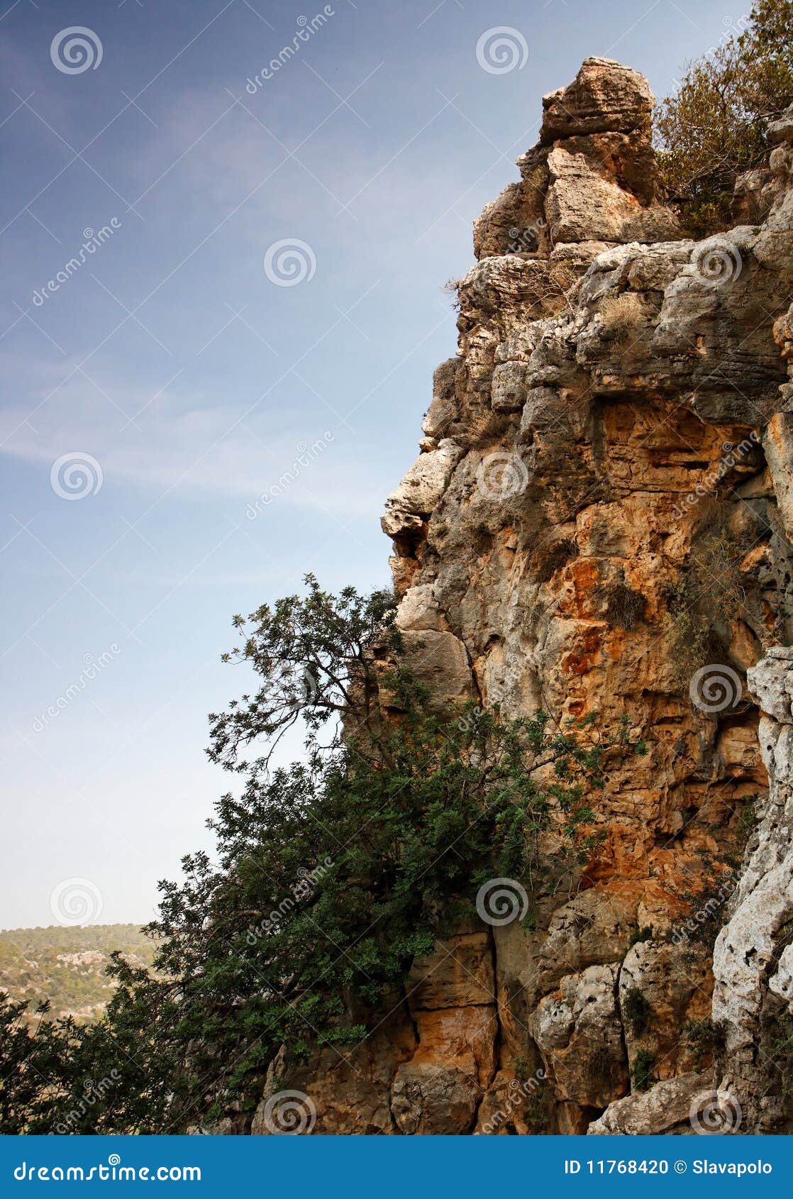 Steep Weathered Cliff Face Over Dramatic Sky Stock Photo - Image of ...