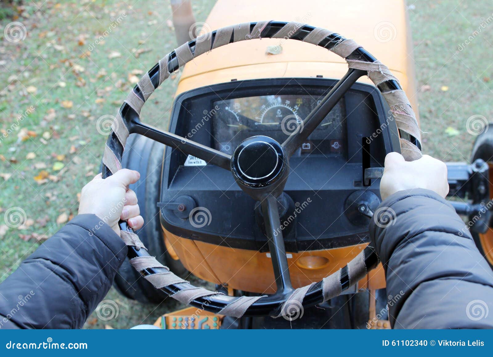 Steering the tractor stock photo. Image of hands, farm - 61102340